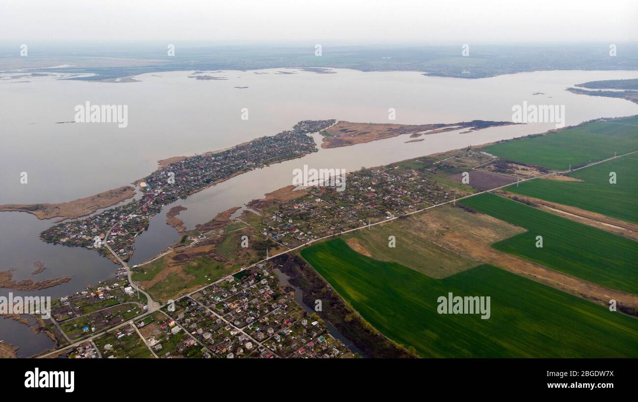Bird's-eye view to the village, streets, roads, islands and river delta ...