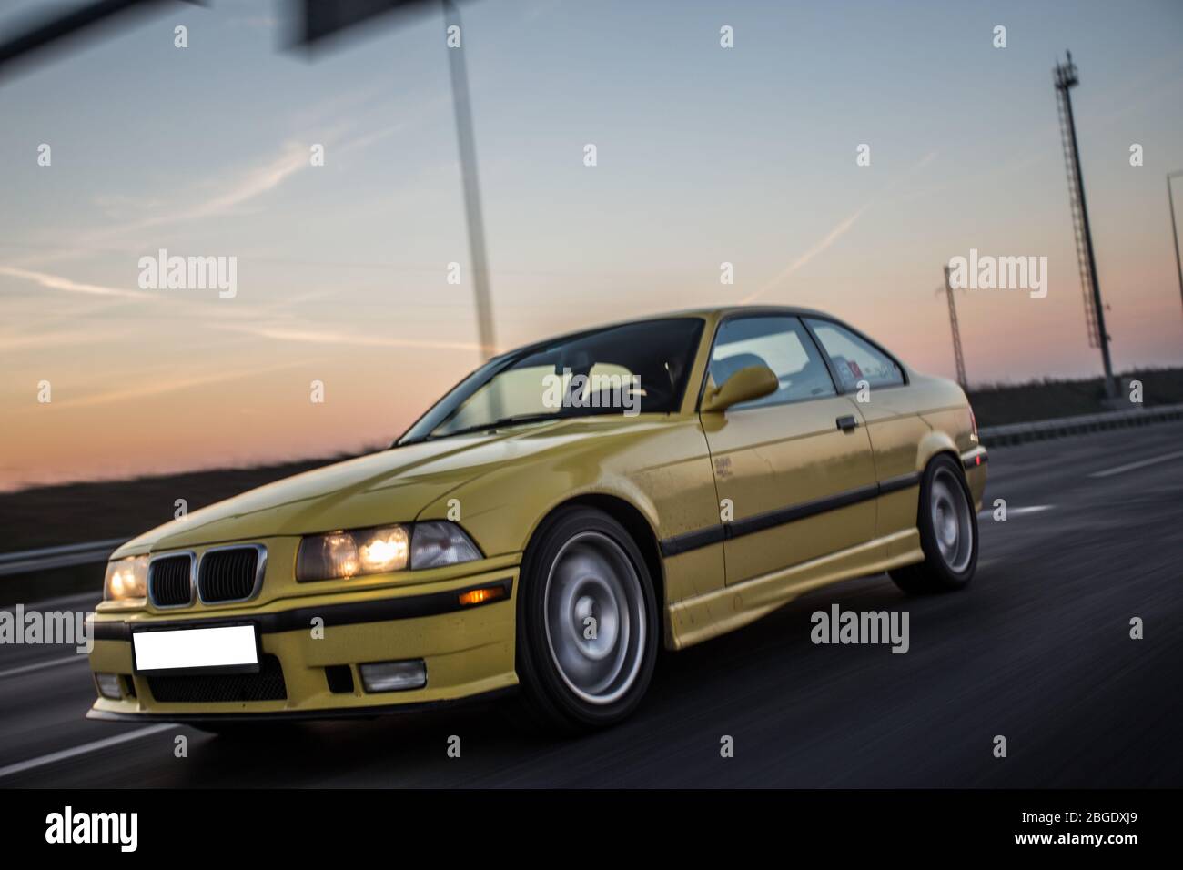 Yellow taxi cab on the sunset drive on the landscapes,angle view Stock ...