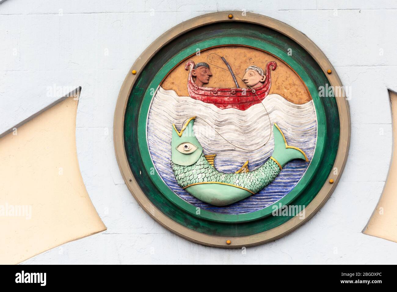 Old emblem of fishermen above Brixton Village, London Stock Photo - Alamy