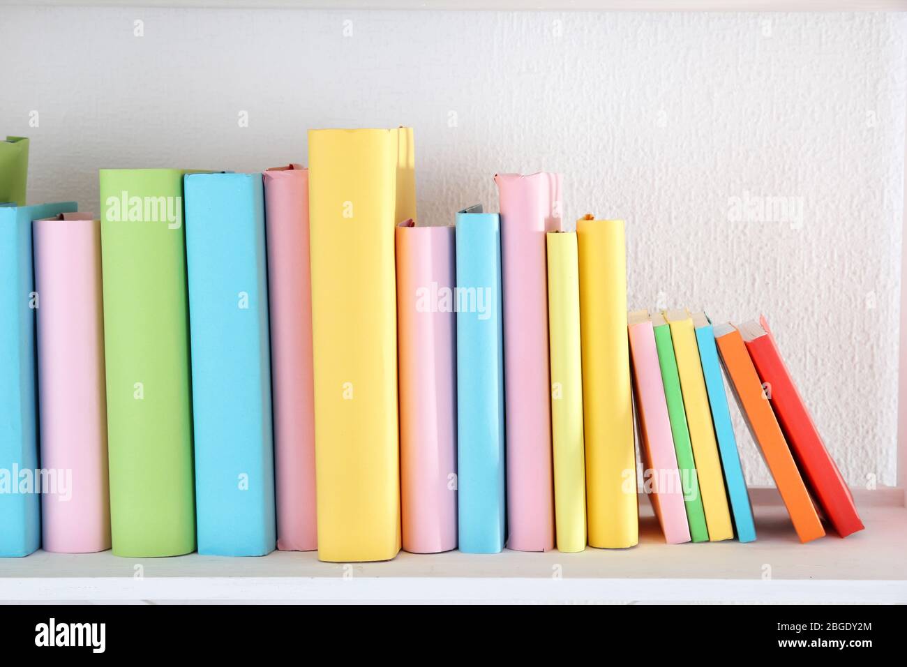 Books on shelf close-up Stock Photo - Alamy