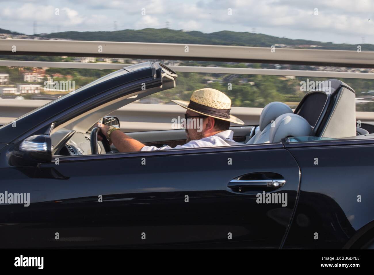 Woman driving convertible highway hi-res stock photography and images ...