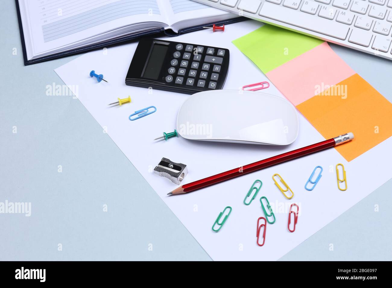 Office table with stationery accessories, keyboard and paper, close up ...