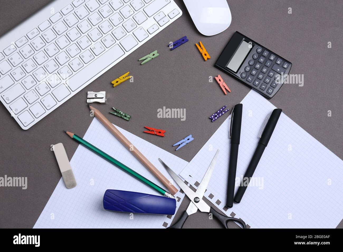 Office table with stationery accessories, keyboard and paper, close up ...