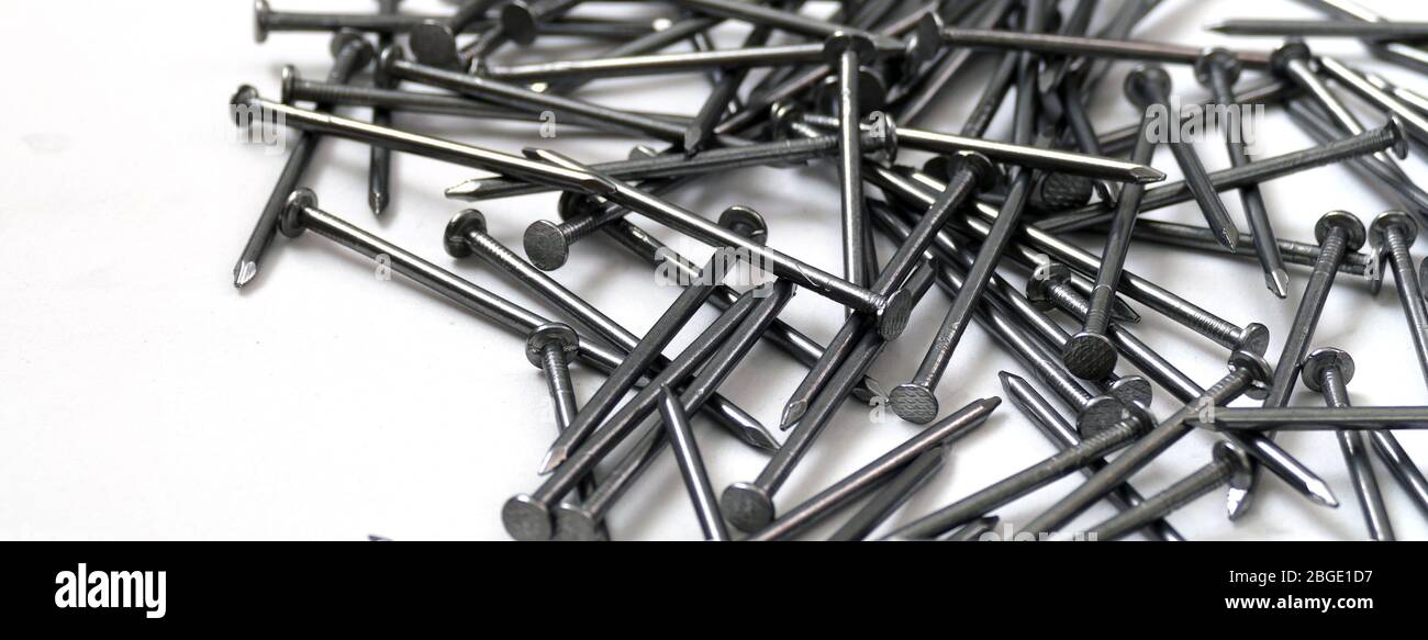 construction nails, a large amount of nails on a white background Stock ...