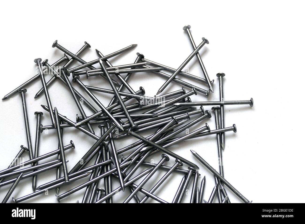 construction nails, a large amount of nails on a white background Stock ...