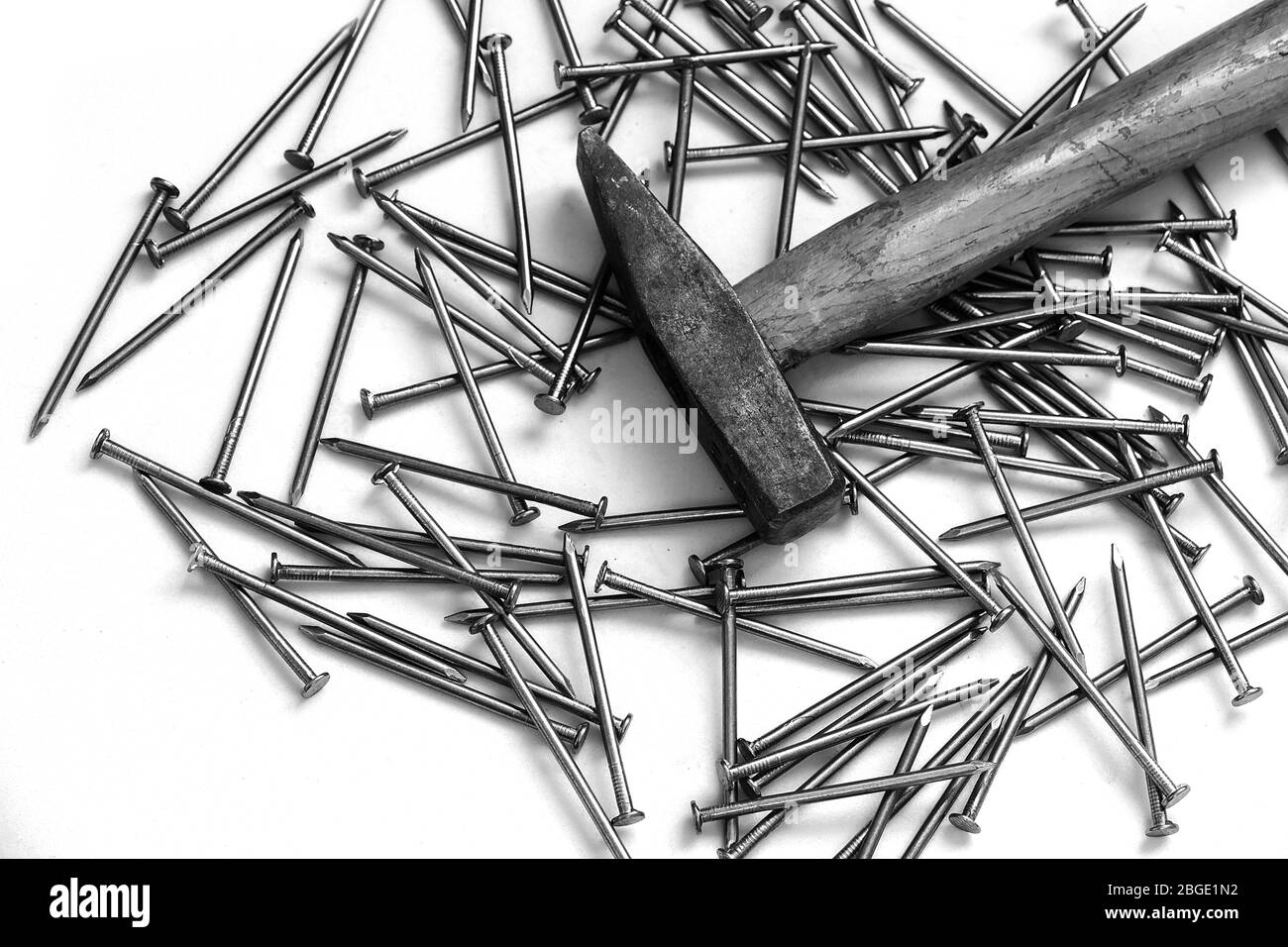 Hammer nail on white Black and White Stock Photos & Images - Alamy