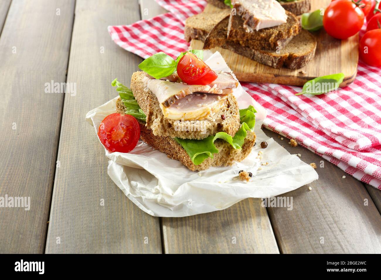 Delicious sandwiches with meet on table close-up Stock Photo - Alamy