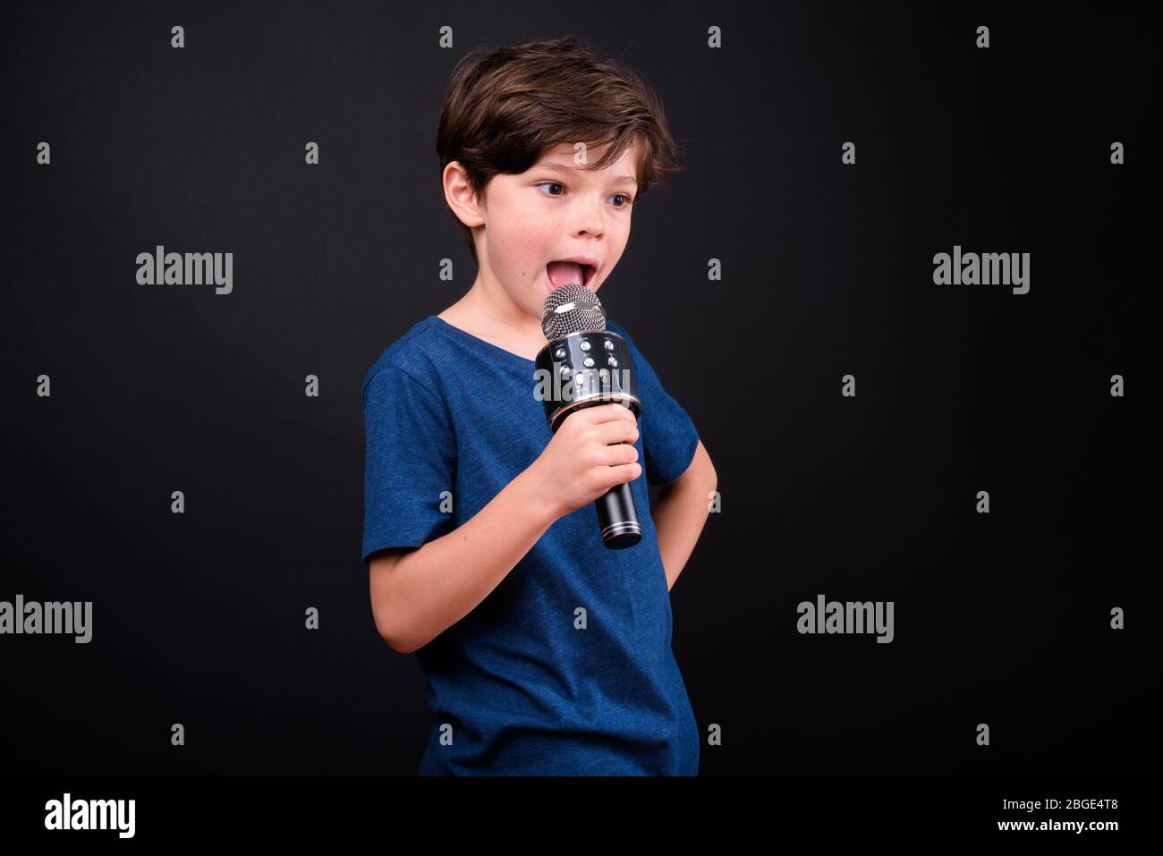 Black microphone boy singing hi-res stock photography and images - Alamy
