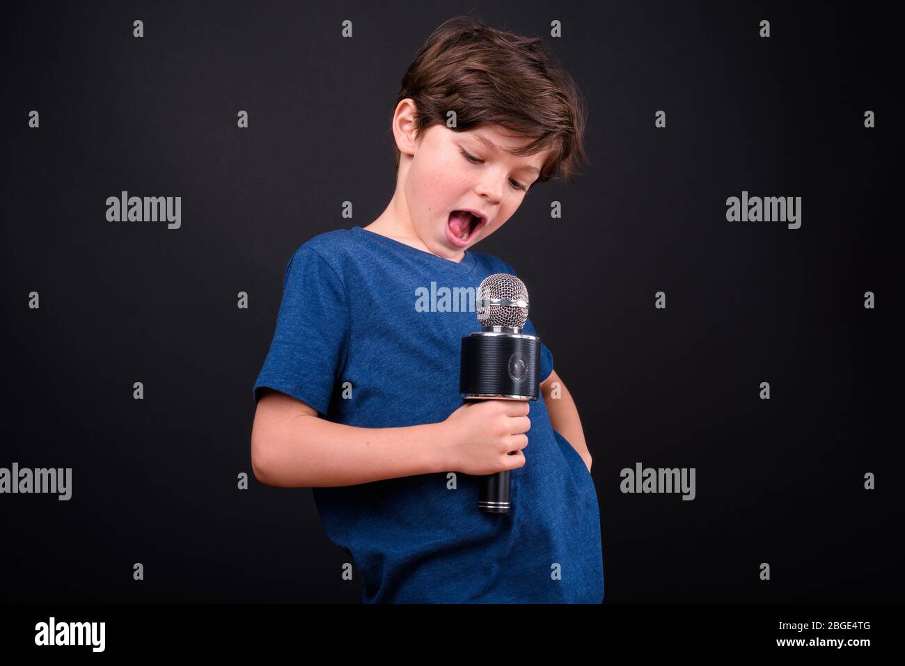 Black microphone boy singing hi-res stock photography and images - Alamy
