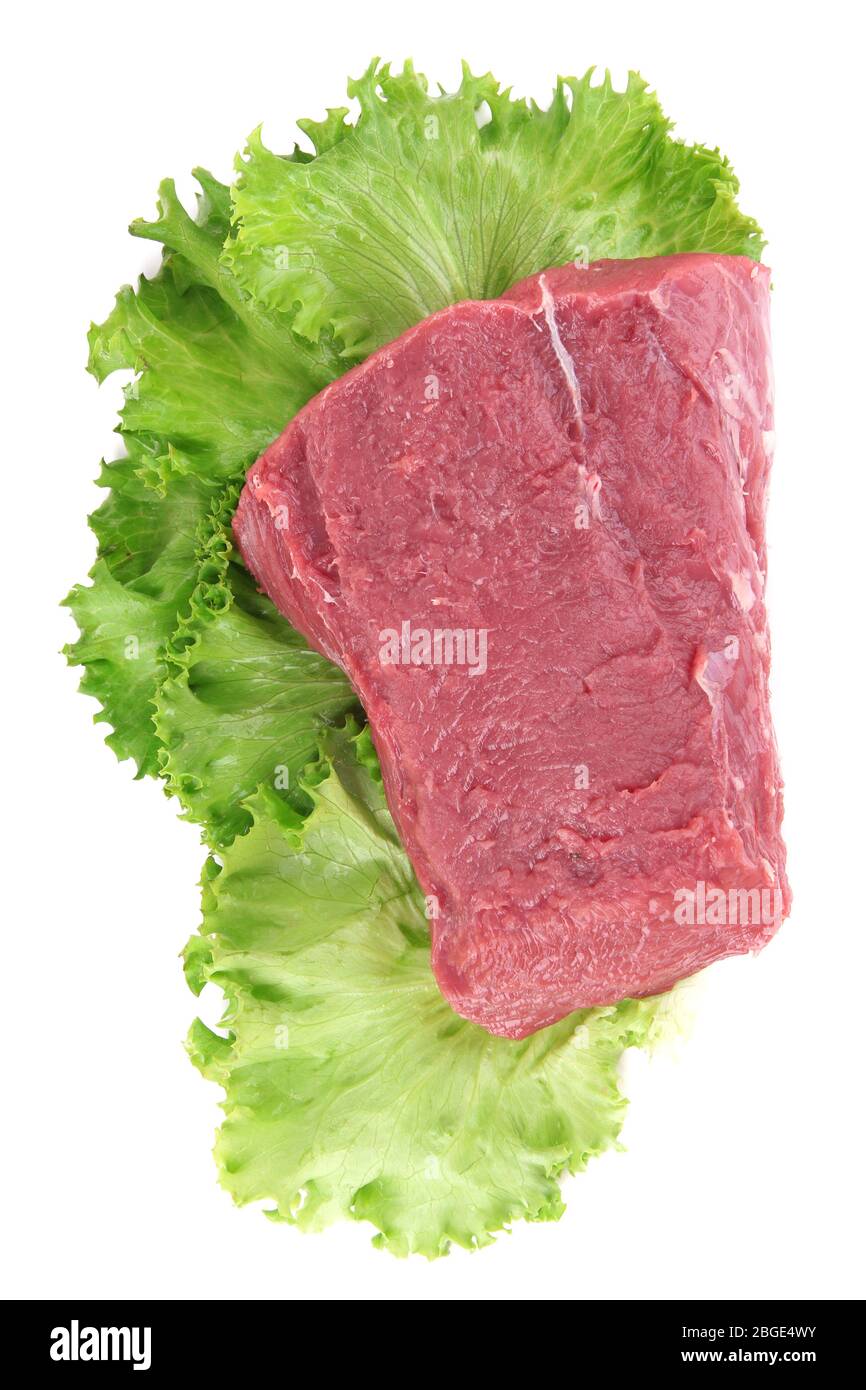 Raw beef meat with lettuce isolated on white Stock Photo - Alamy