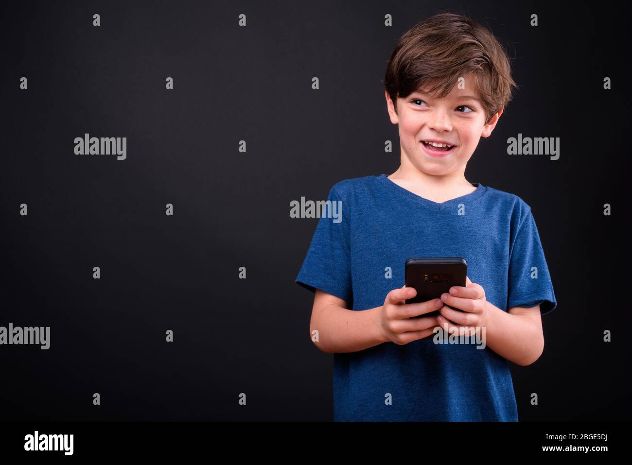 Child phone studio thinking hi-res stock photography and images - Alamy