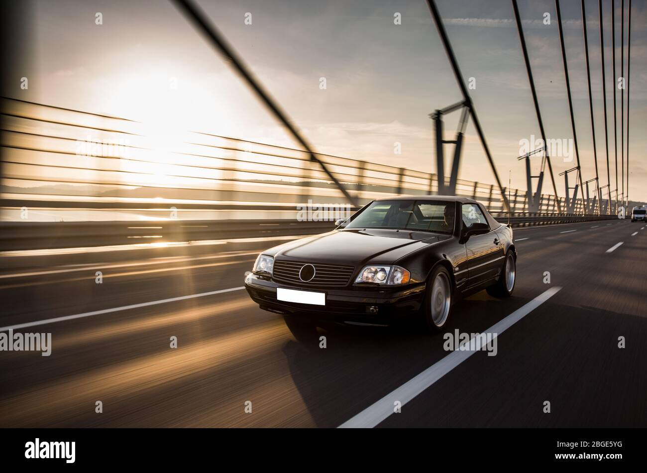Old model sedan car on the bridge under sun Stock Photo - Alamy