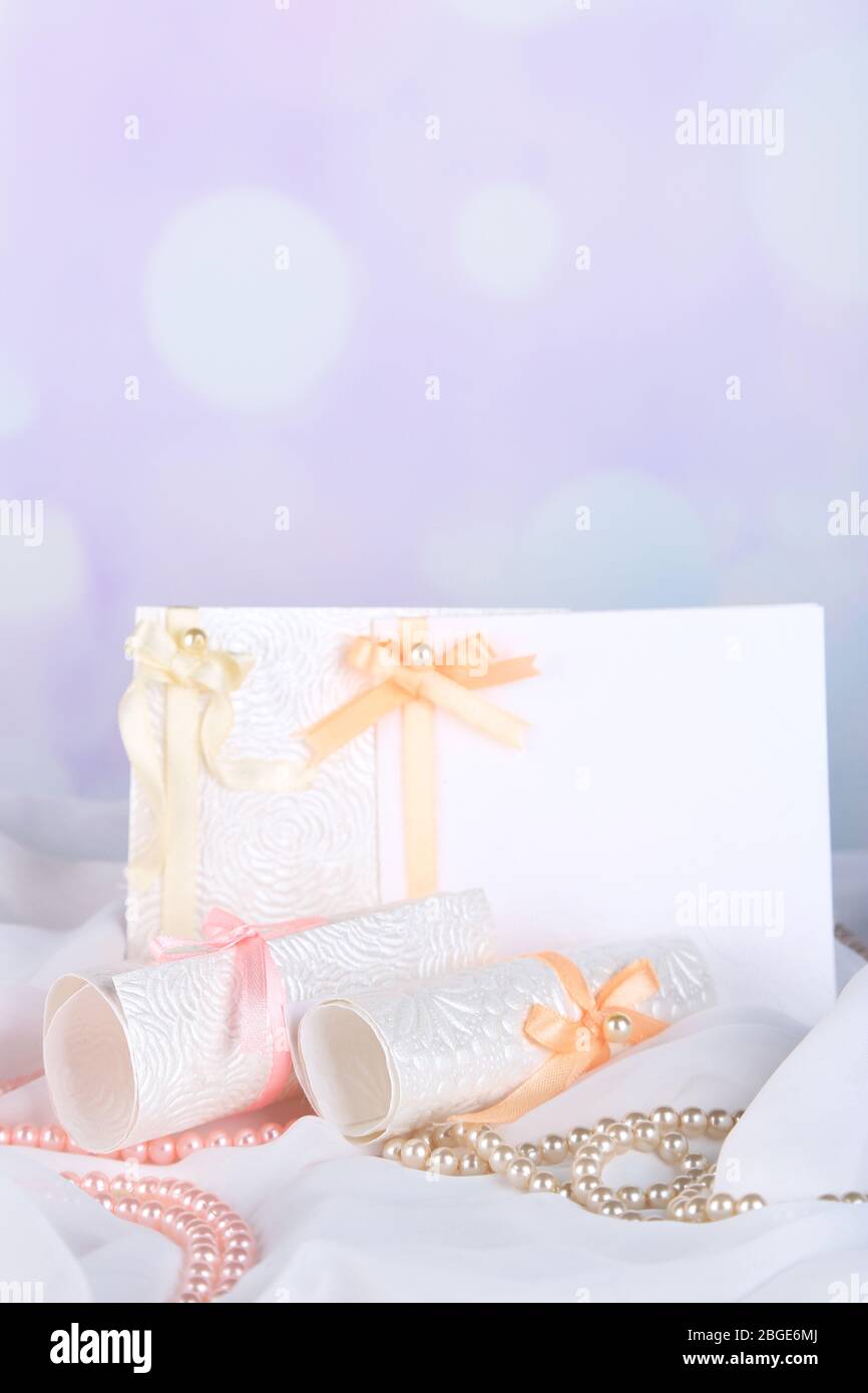 Beautiful handmade wedding cards on light background Stock Photo - Alamy