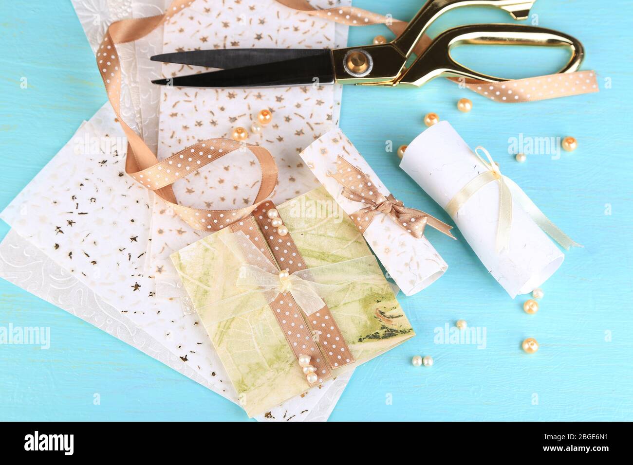 Beautiful handmade wedding cards on blue background Stock Photo - Alamy