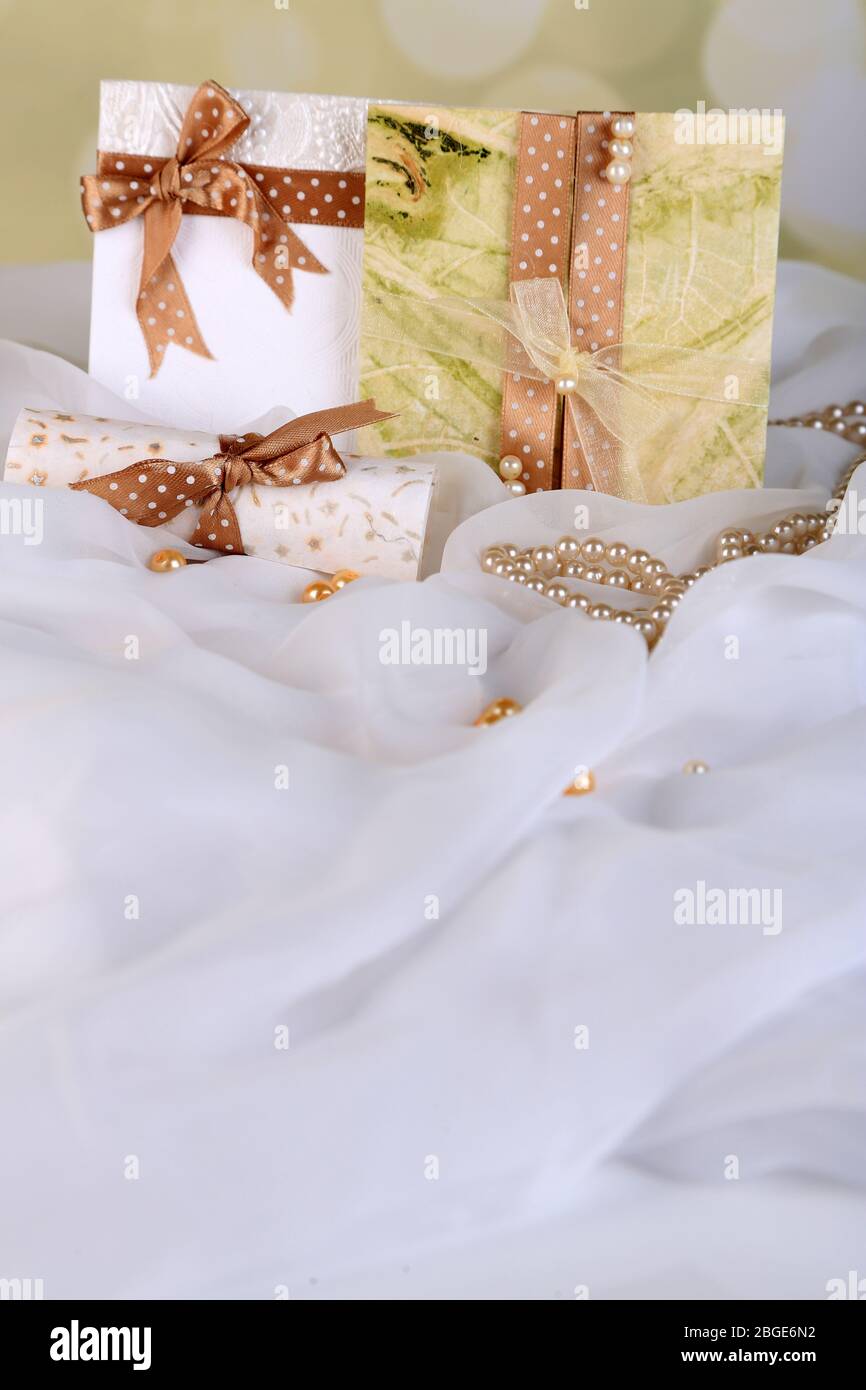 Beautiful handmade wedding cards on light background Stock Photo - Alamy