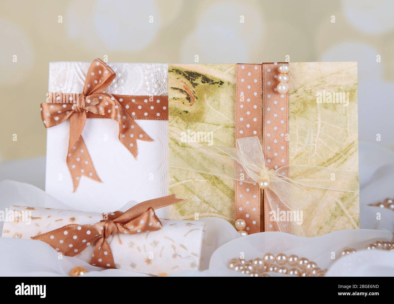 Beautiful handmade wedding cards on light background Stock Photo - Alamy
