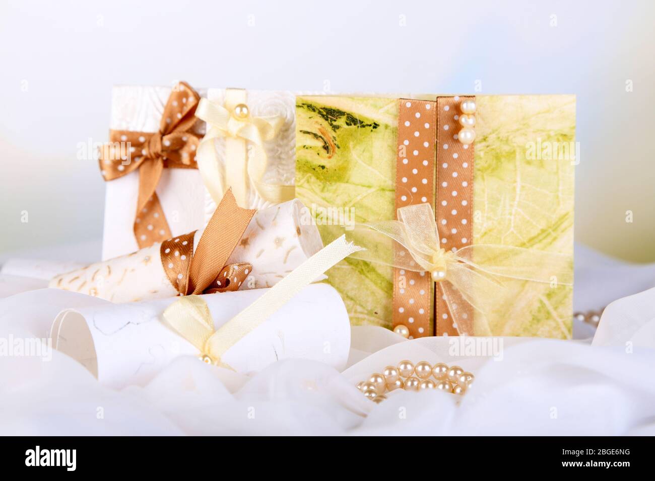 Beautiful handmade wedding cards on light background Stock Photo - Alamy