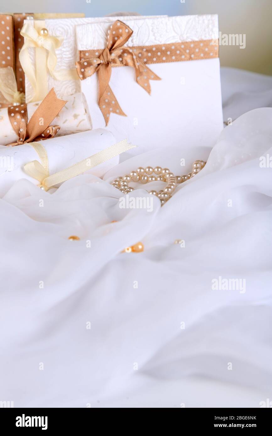 Beautiful handmade wedding cards on light background Stock Photo - Alamy