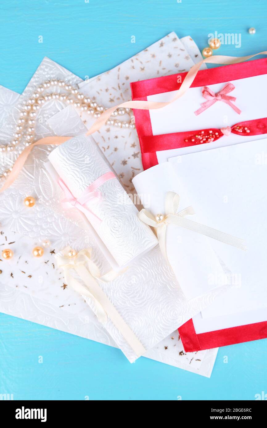 Beautiful handmade wedding cards on blue background Stock Photo - Alamy