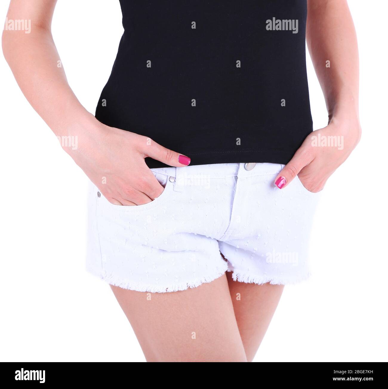 Beautiful young girl in shorts and t-shirt, close-up, isolated on white ...