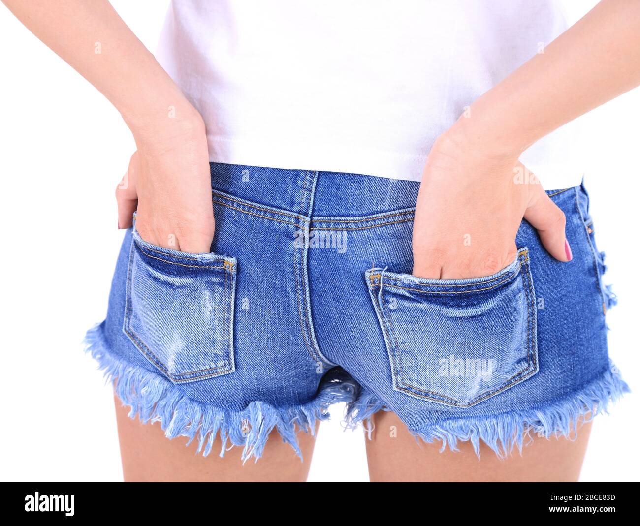 Beautiful young girl in shorts and t-shirt, close-up, isolated on white ...