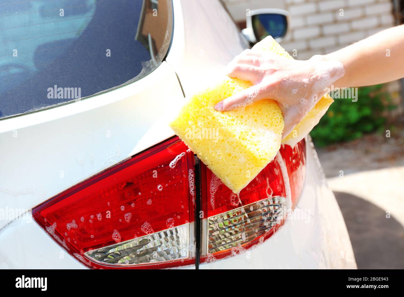 Outdoor car wash with yellow sponge Stock Photo - Alamy