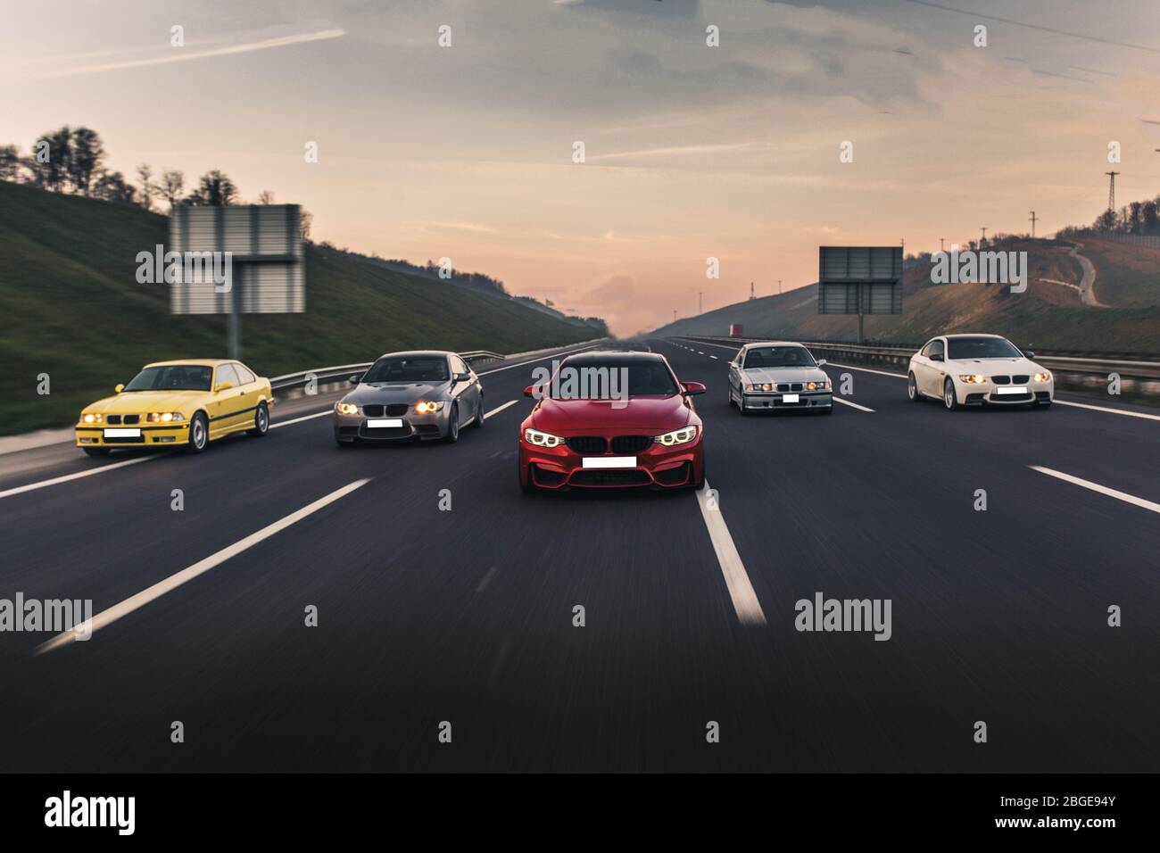 Multiple color racecar in the sunset drive in the forest Stock Photo ...