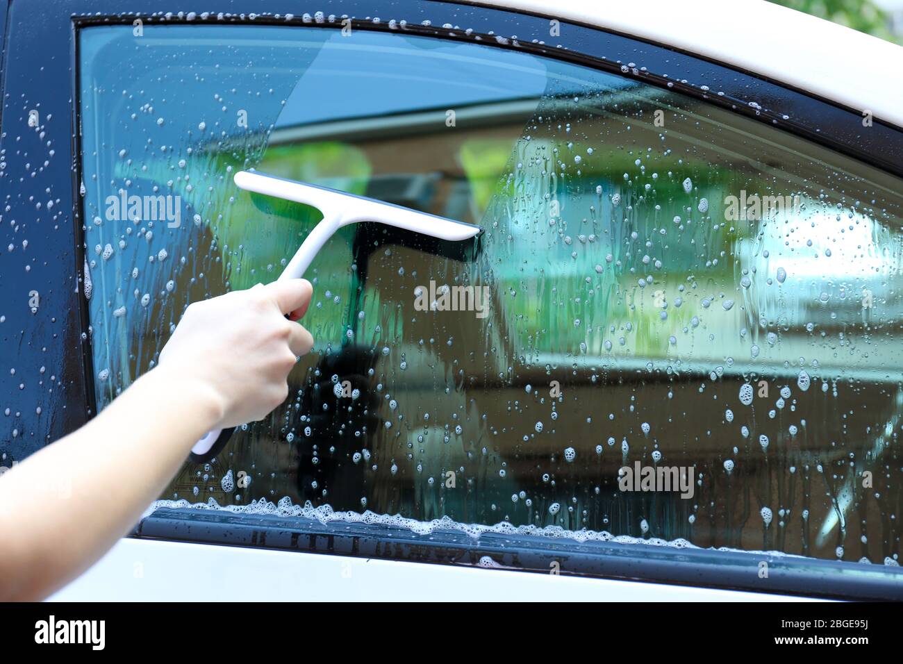 Hand washing car window Stock Photo - Alamy