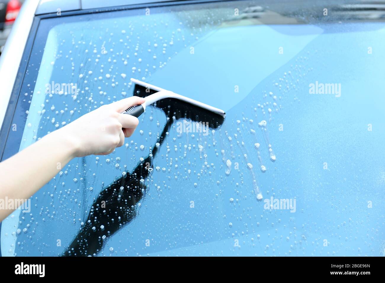 Hand washing car window Stock Photo - Alamy
