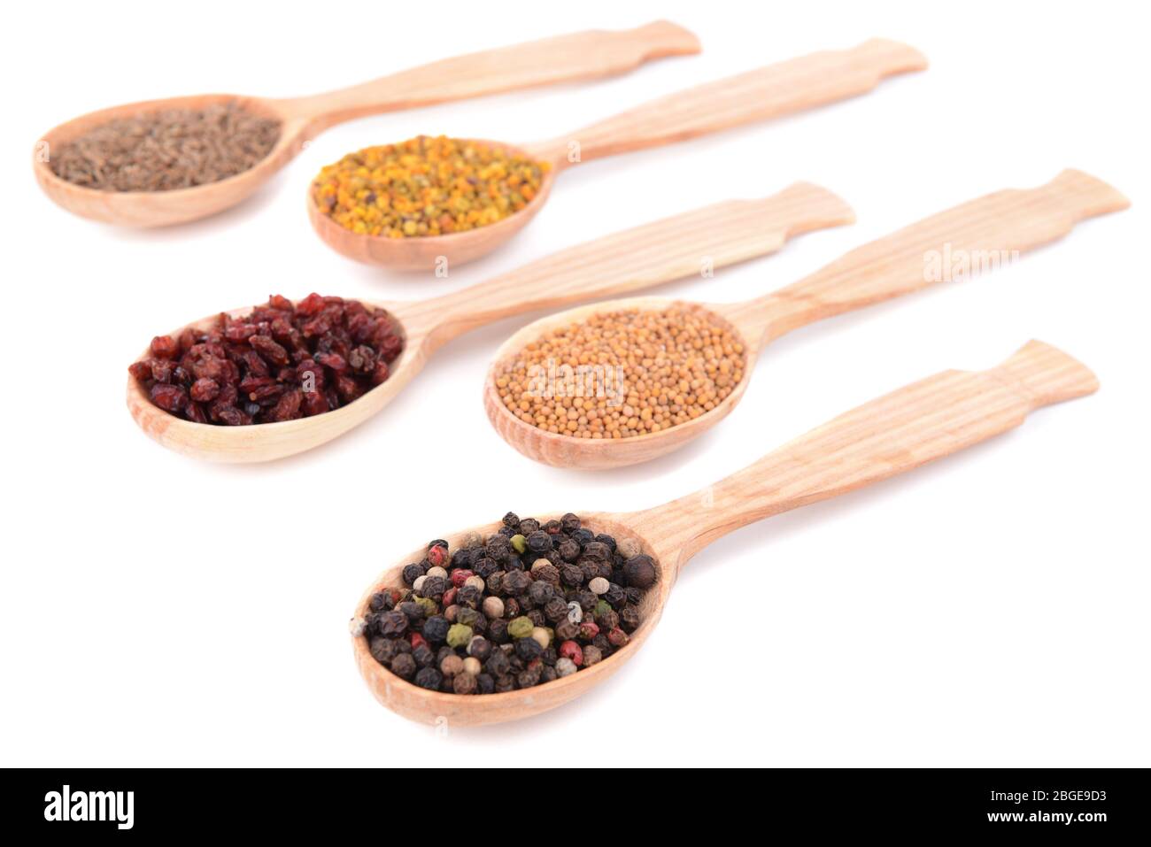 Different spices in spoons isolated on white Stock Photo - Alamy