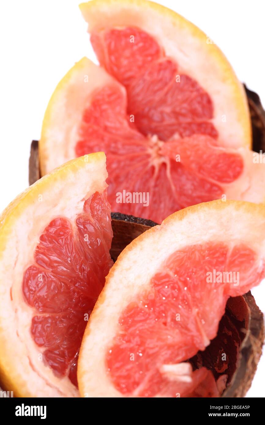 Grapefruit slices in coconut shell isolated on white Stock Photo - Alamy