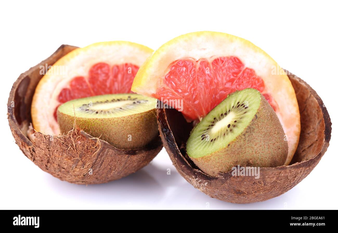 Grapefruit slices in coconut shell isolated on white Stock Photo - Alamy