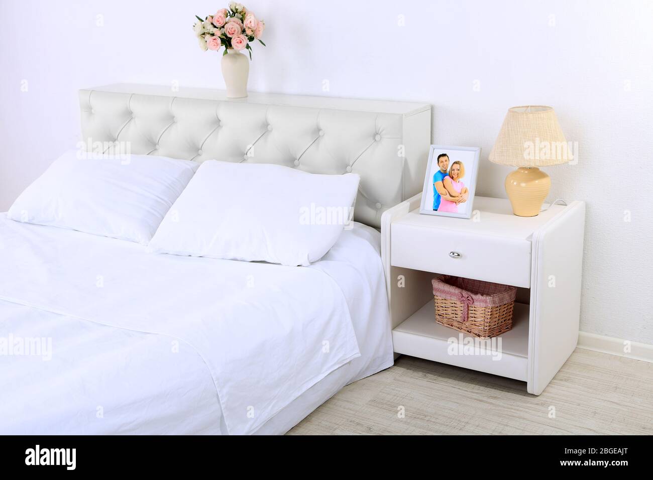 Comfortable soft bed in room Stock Photo - Alamy