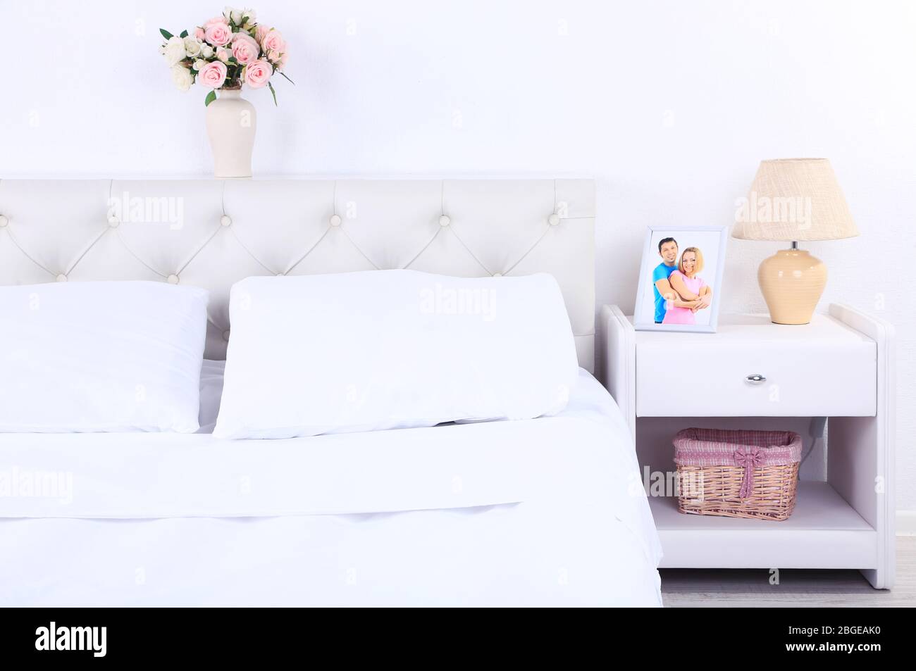 Comfortable soft bed in room Stock Photo - Alamy