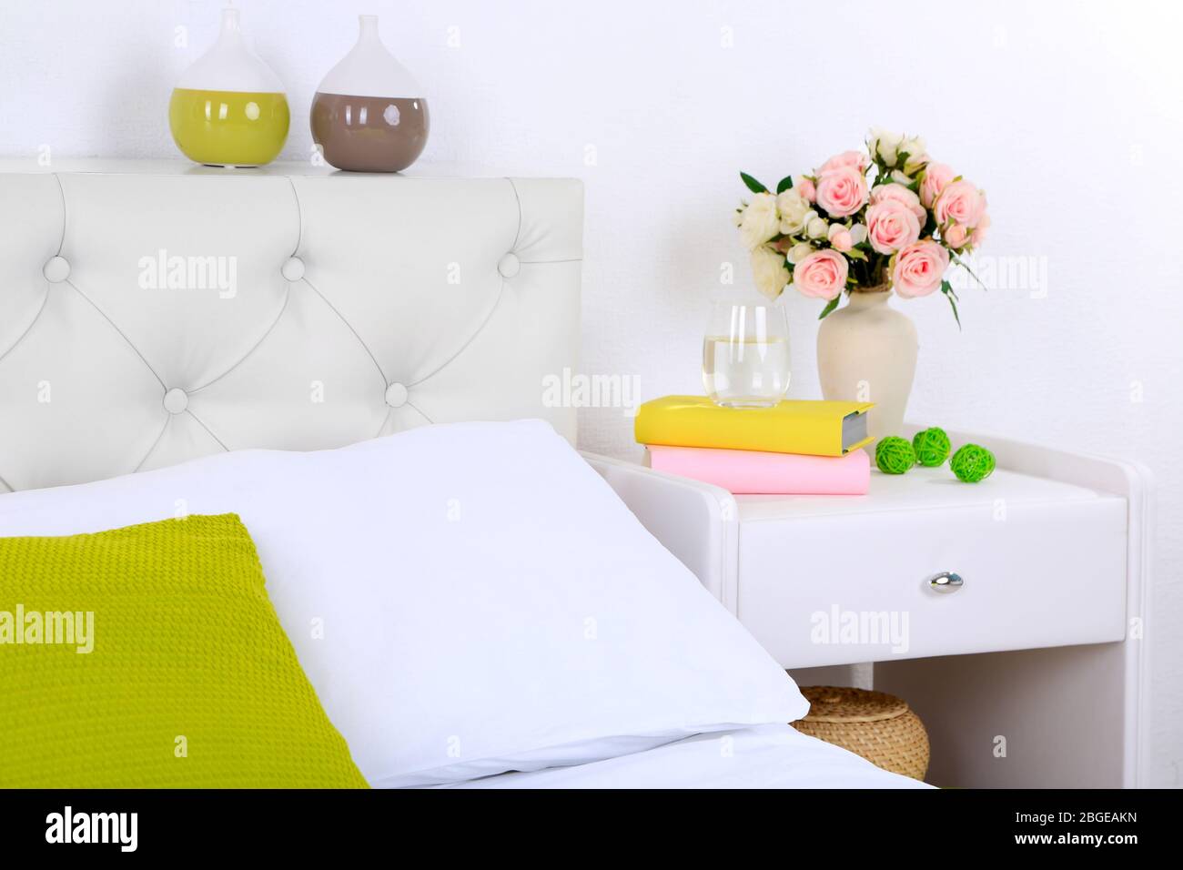 Comfortable soft bed in room Stock Photo - Alamy