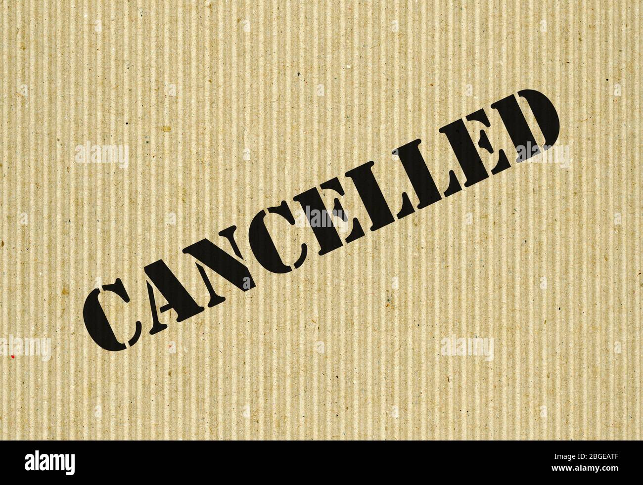 Cancelled label written on brown corrugated cardboard Stock Photo - Alamy