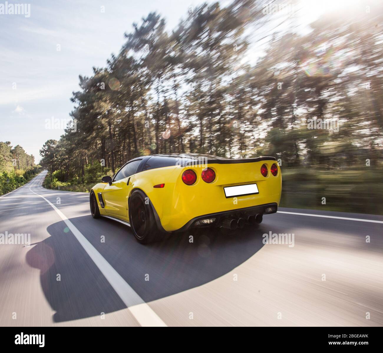 Yellow racing car with red xenon lights Stock Photo - Alamy