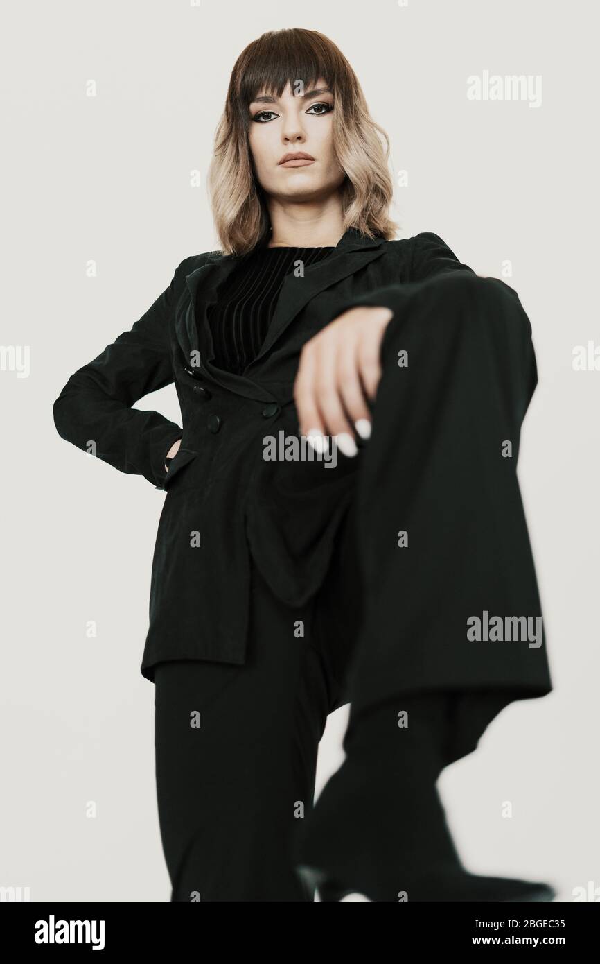 Portrait beautiful bossy woman with attitude wearing black clothes ...