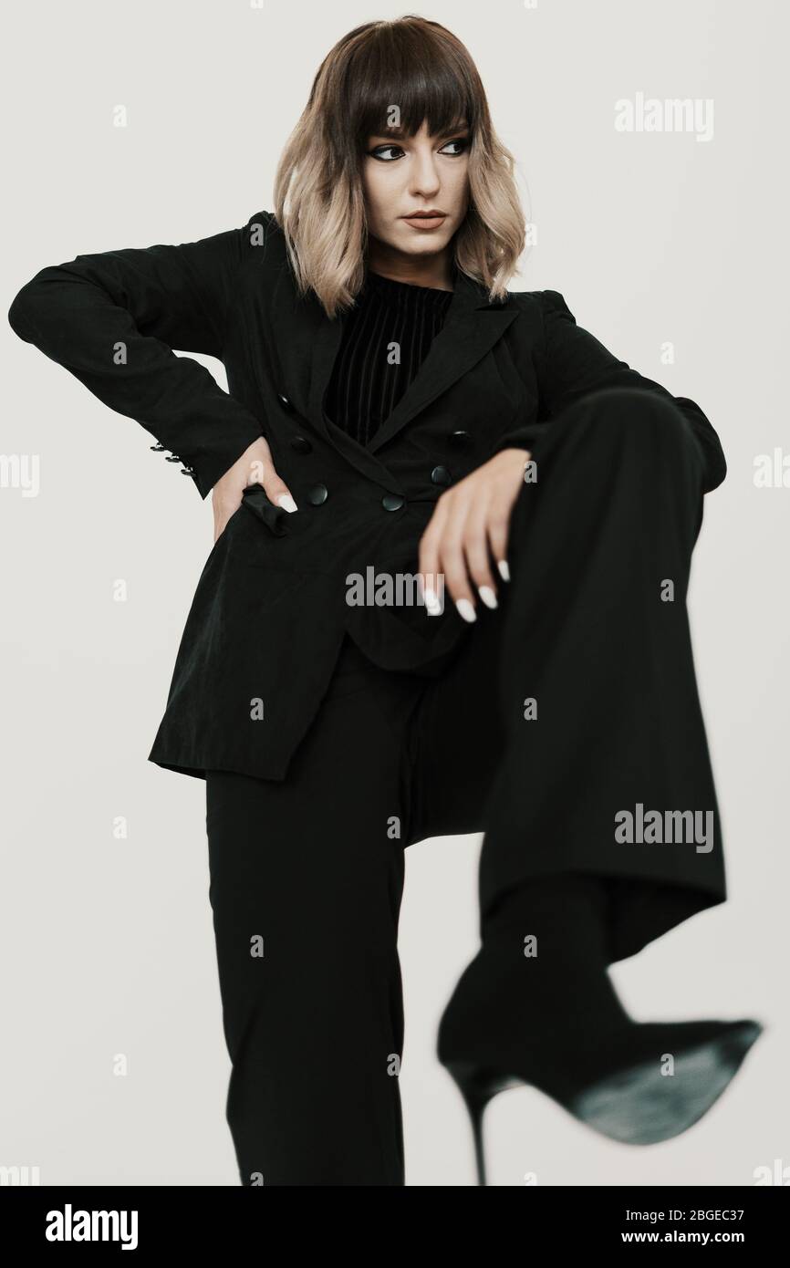 Portrait beautiful bossy woman with attitude wearing black clothes ...