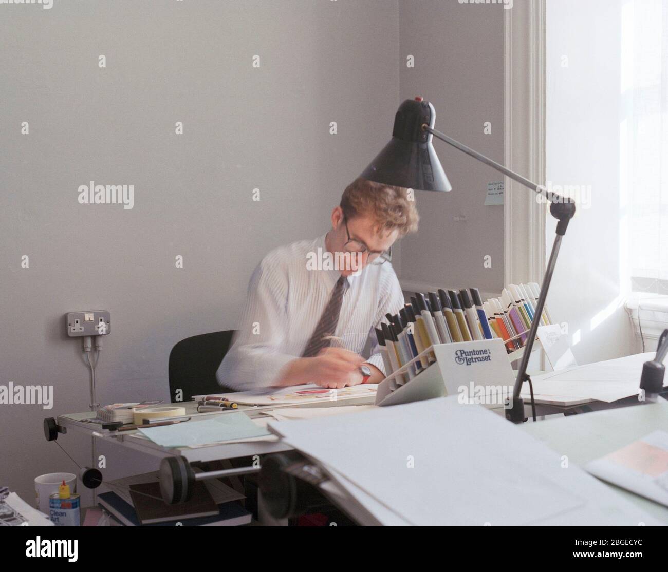Workers in a typical 1990 graphic design studio office, UK Stock Photo ...