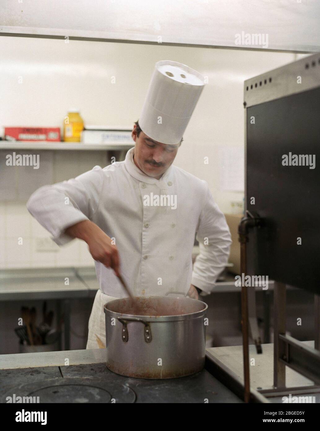 Kitchen staff in a 1990's restaurant, typical of the time. UK Stock ...