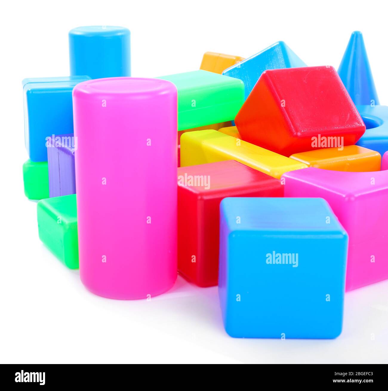 Colorful plastic toys isolated on white Stock Photo - Alamy