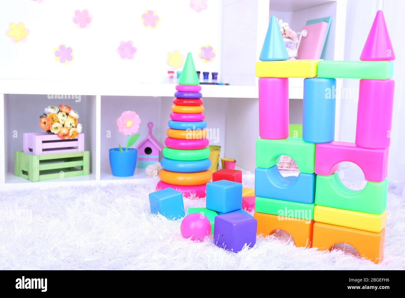 Colorful plastic toys in children room Stock Photo - Alamy