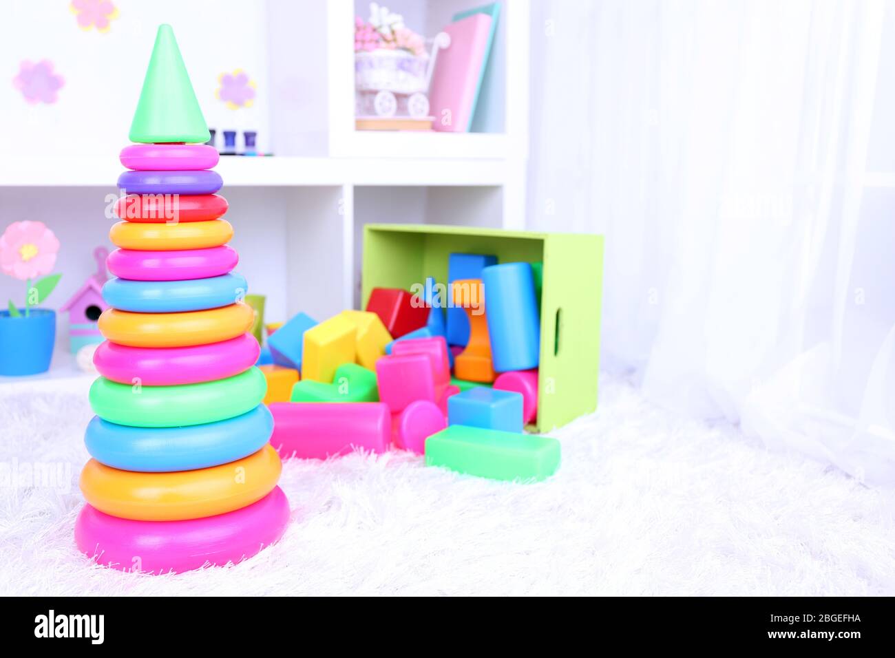 Colorful plastic toys in children room Stock Photo - Alamy