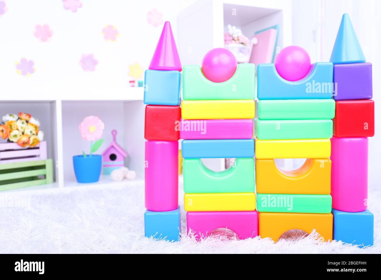 Colorful plastic toys in children room Stock Photo - Alamy