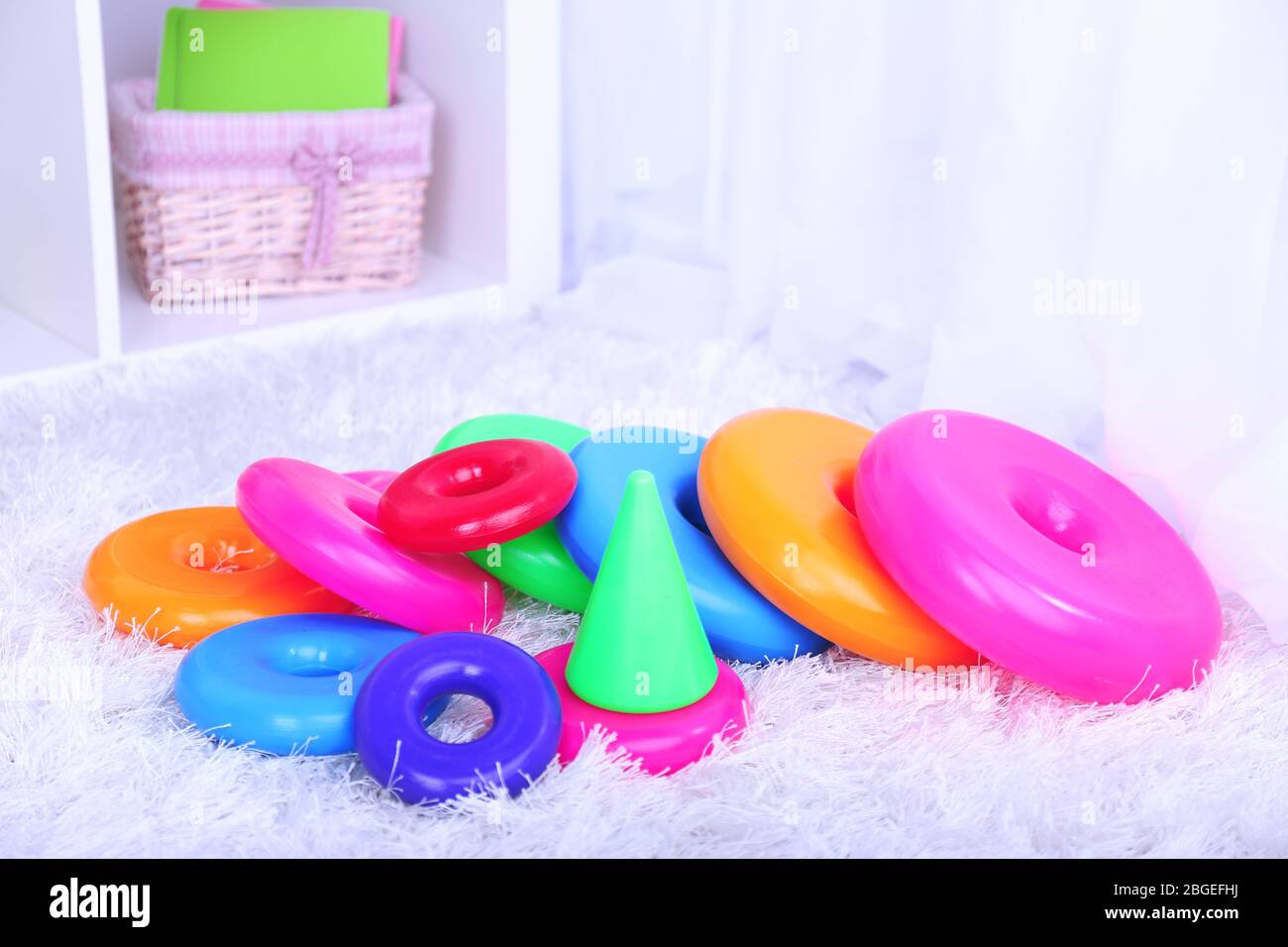 Colorful plastic toys in children room Stock Photo - Alamy