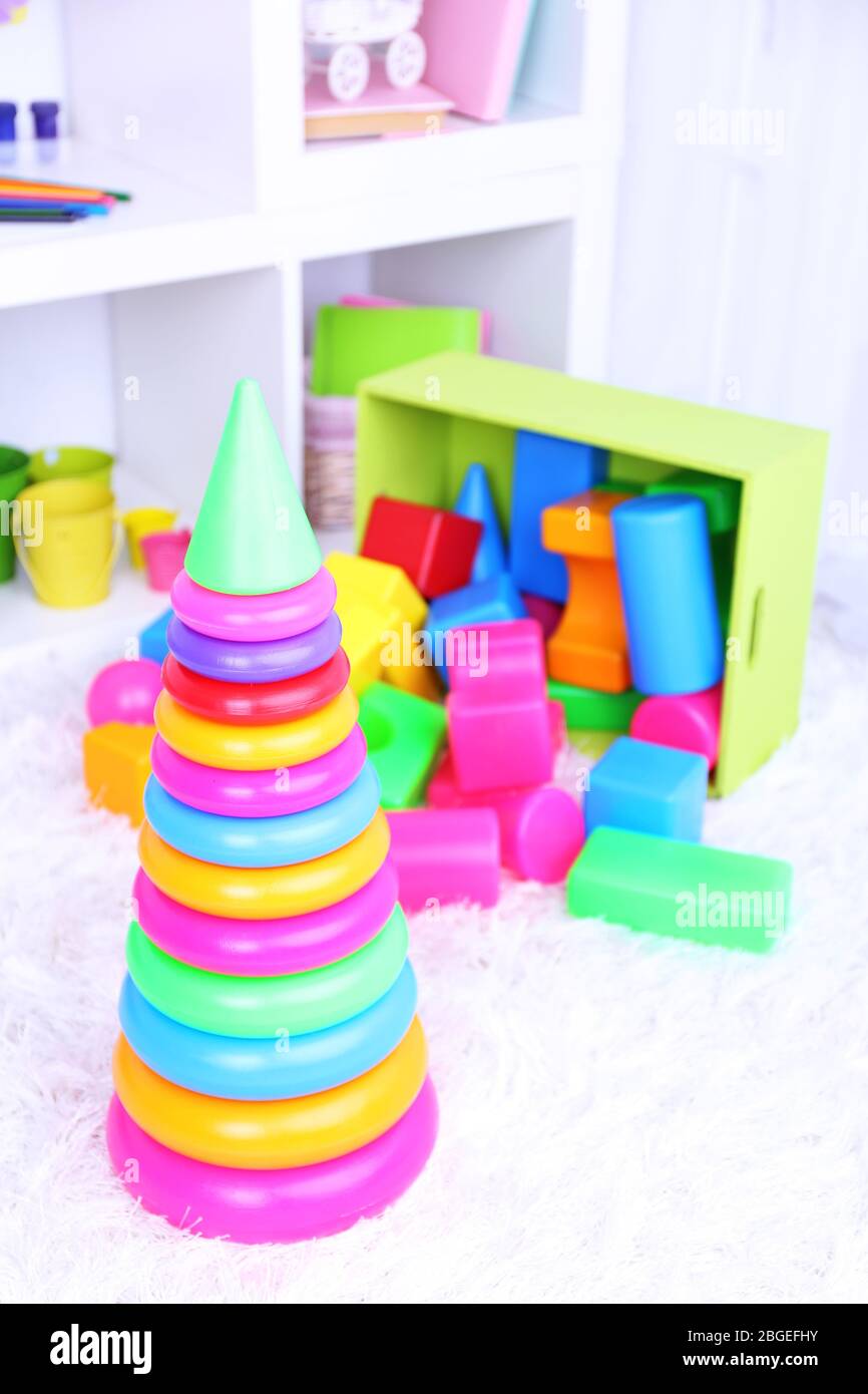 Colorful plastic toys in children room Stock Photo - Alamy