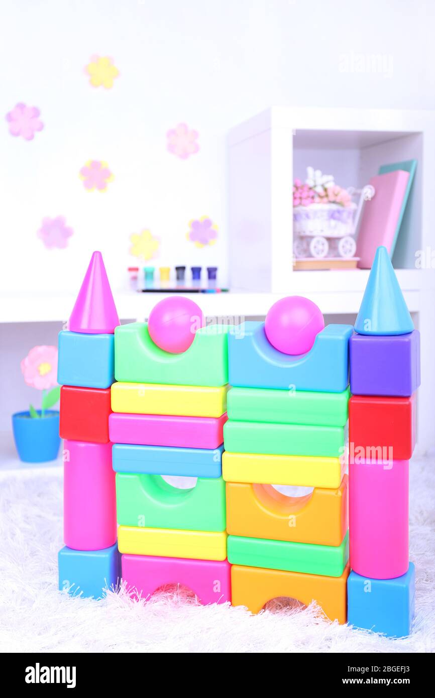 Colorful plastic toys in children room Stock Photo - Alamy
