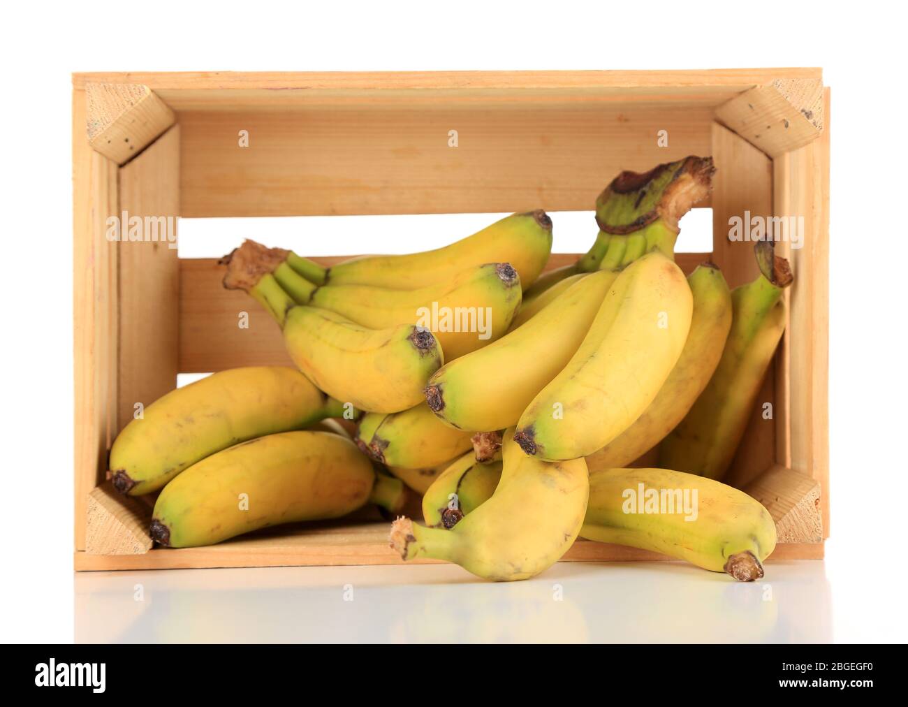Bunch of mini bananas in wooden box isolated on white Stock Photo - Alamy