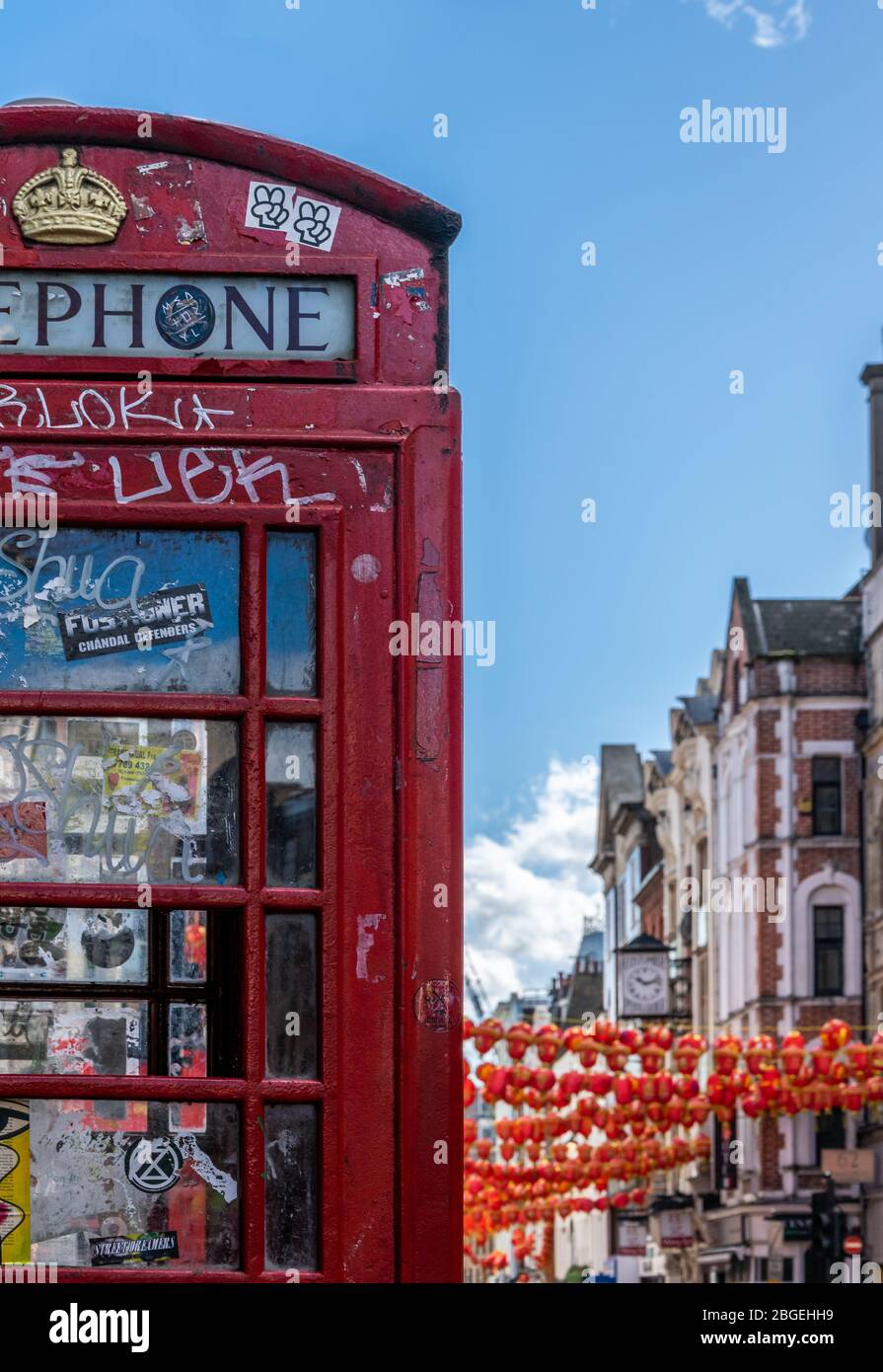 Outdated phone box covered in stickers and graffiti in London,UK Stock ...